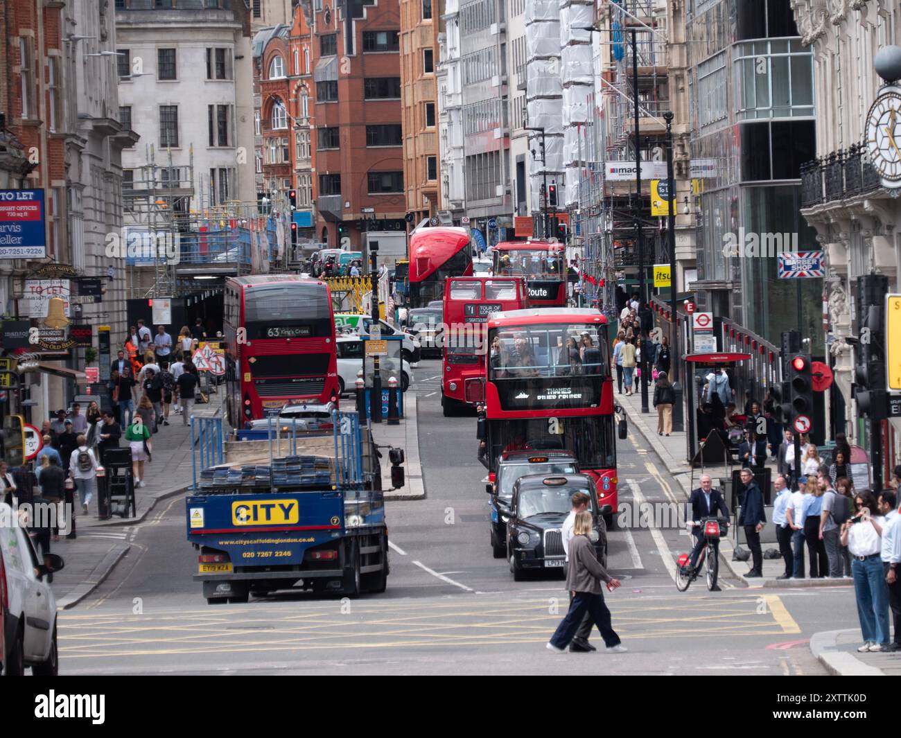 Busy Fleet Street with pedestrians, buses and taxi cab London United ...