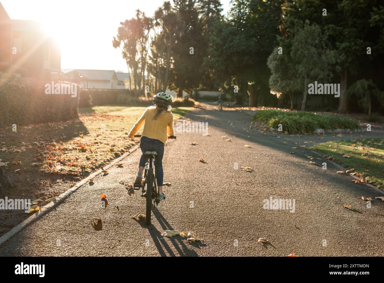 Active child riding bike in park Stock Photo - Alamy
