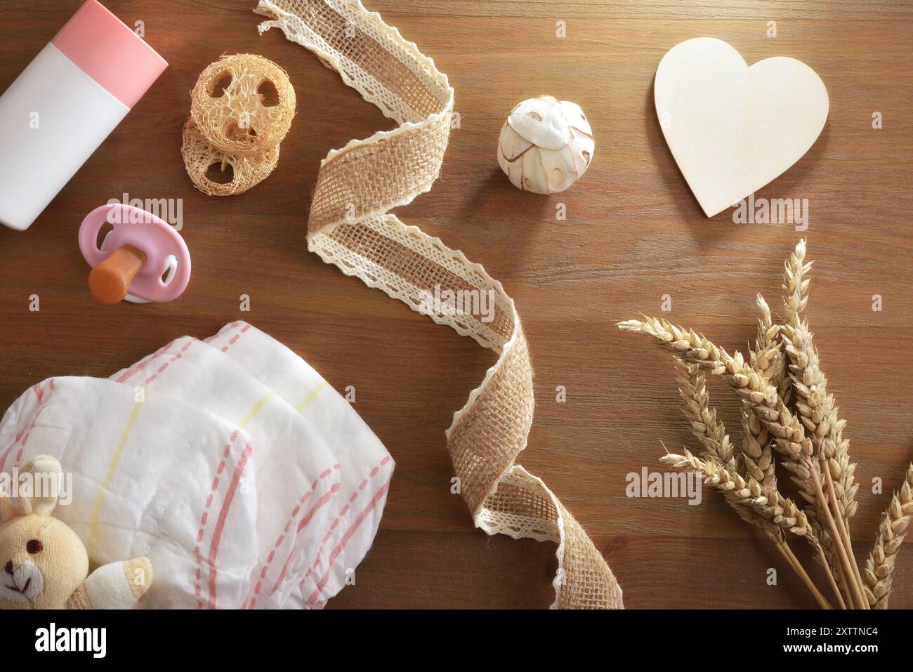 Diapers for changing the baby on wooden table with jar with talcum ...