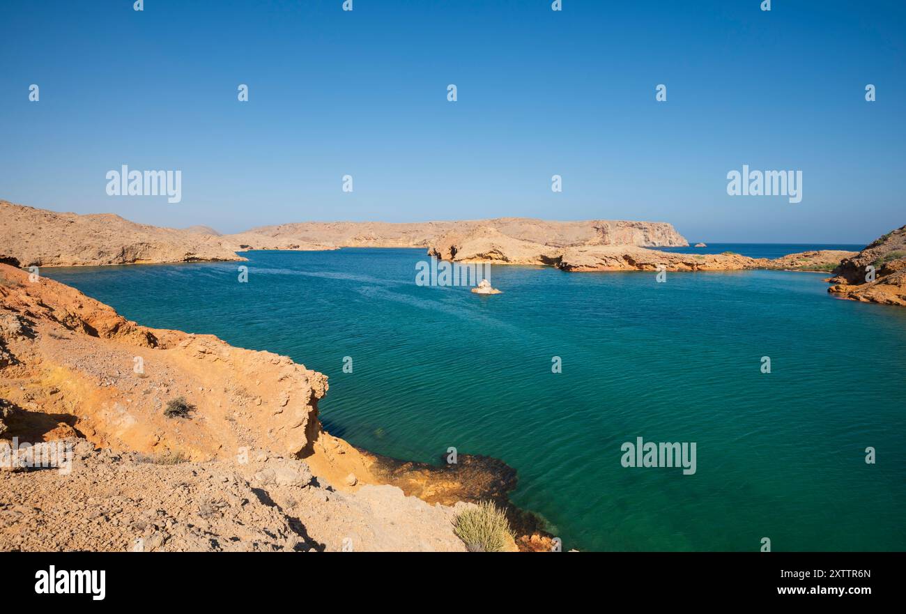 Fjord-like landscape in the Sultanate of Oman with tranquil waters, a ...