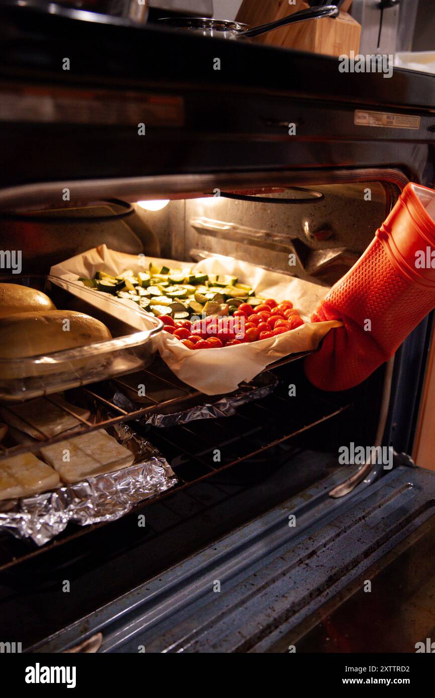 Removing pan from oven hi-res stock photography and images - Alamy