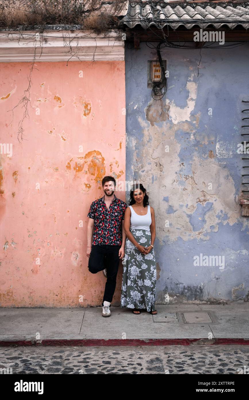 Multicultural Couple Poses in front of a colorful wall in Antigua Stock ...