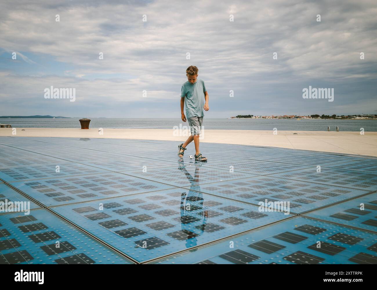 A boy playing with small ball Stock Photo - Alamy