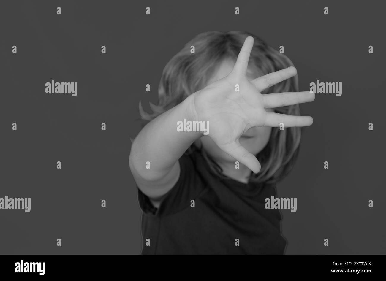 Kid making stop gesture on isolated studio background. Kid showing ...