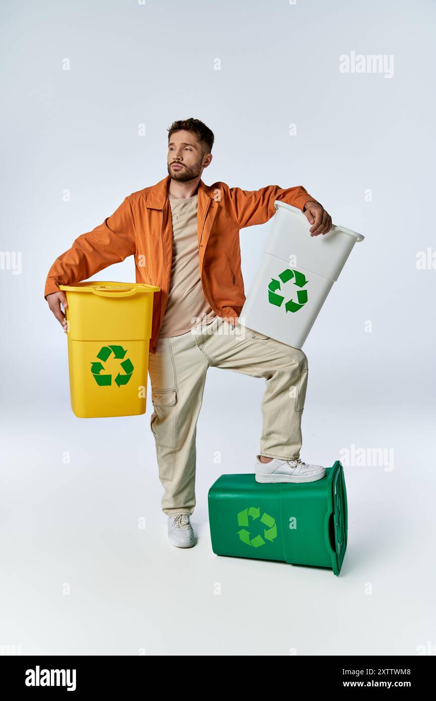Man displays recycling bins, showing eco-friendly dedication Stock ...