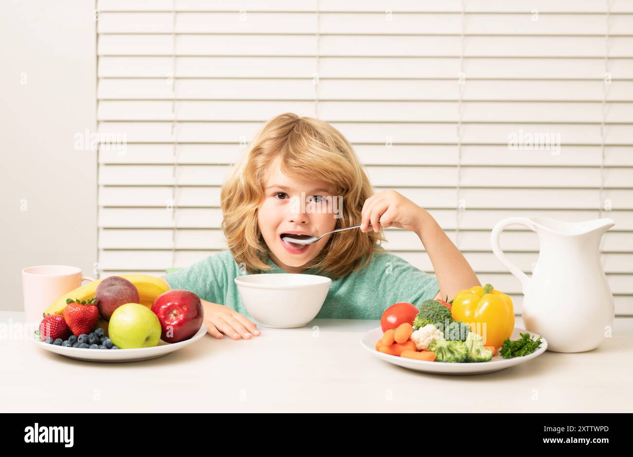 Little child boy having healthy breakfast. Kids nutrition and ...