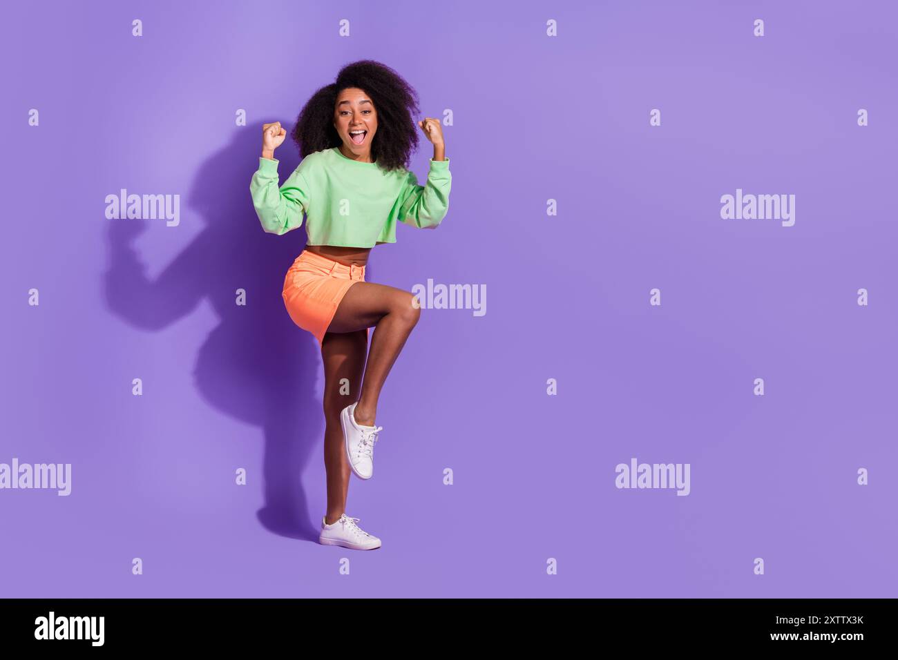 Photo of young american girl wavy curly hair chevelure wear mini skirt ...