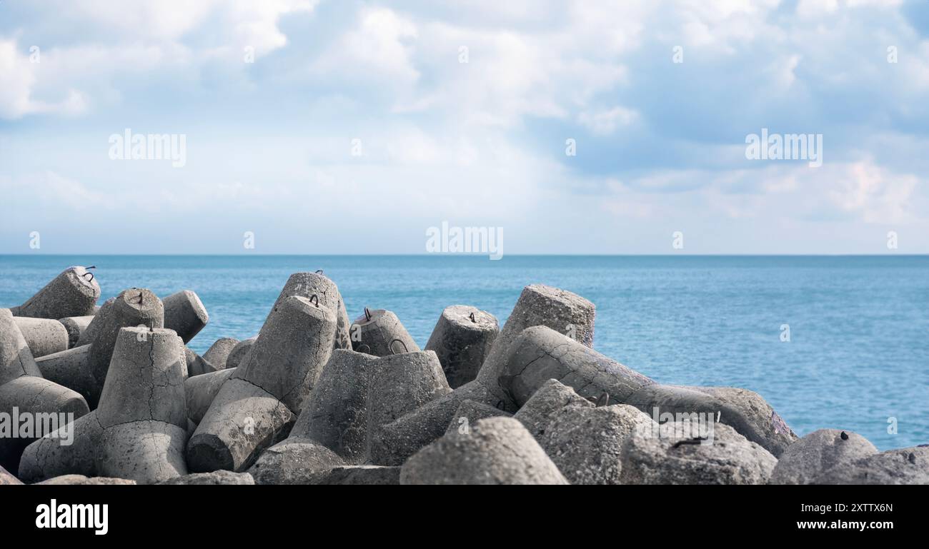 The breakwater is holding back the strong sea waves Stock Photo - Alamy