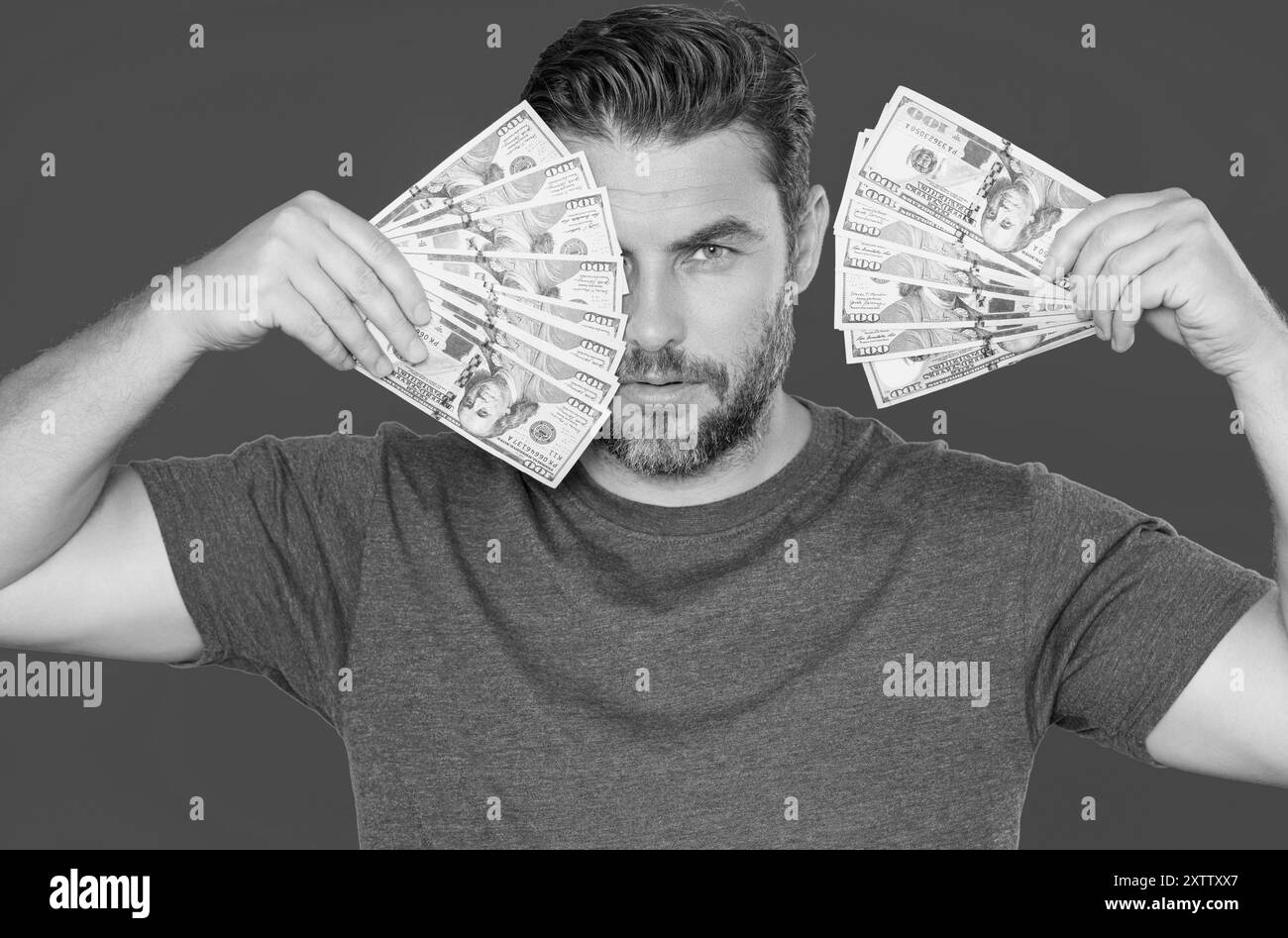 Man with money cash. Dollar banknotes. Portrait of man holding bunch of ...