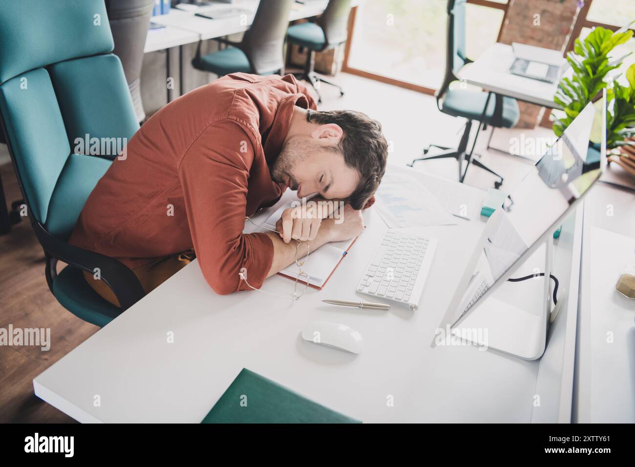 Photo of smart man tired sleep lying table wear brown formalwear ...