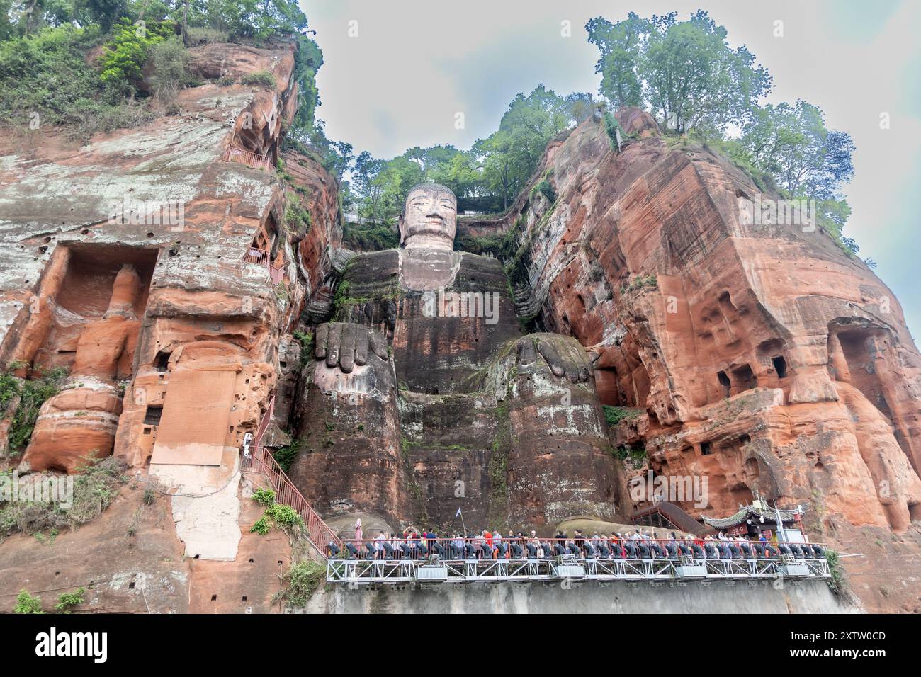 Visitors appreciating the Leshan GIant Buddha on platform. It is a 71 ...
