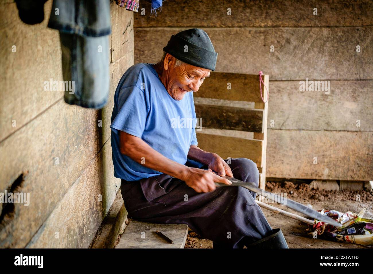 Old man sharpening his knife, Little Treasure, La Taña, Northern ...