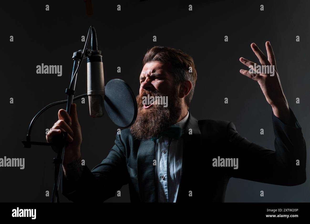 Singer gestures with hands. Man singing with music microphone Stock ...