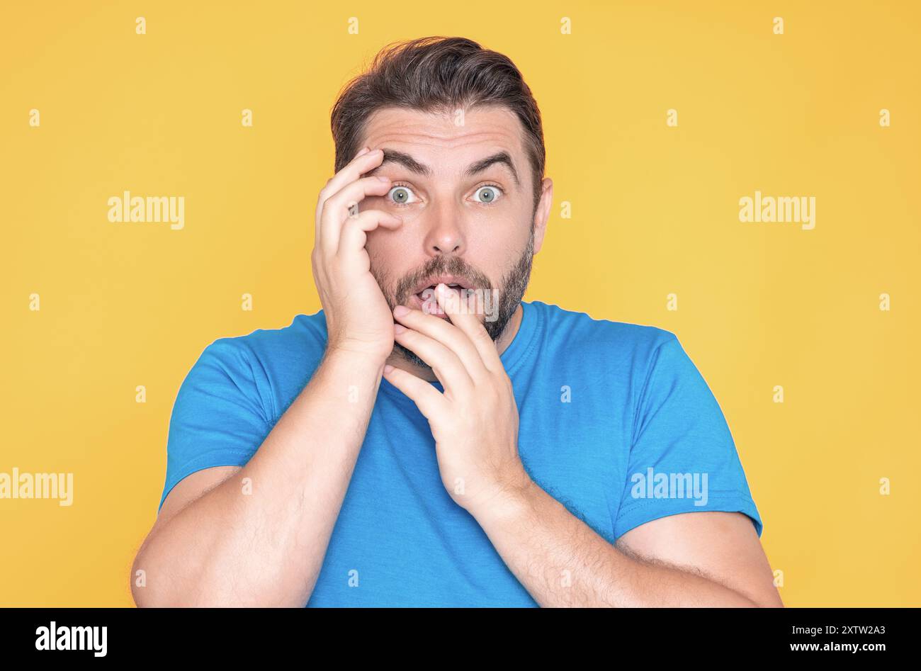 Emotional scared man looks with frightened expression, nervously ...
