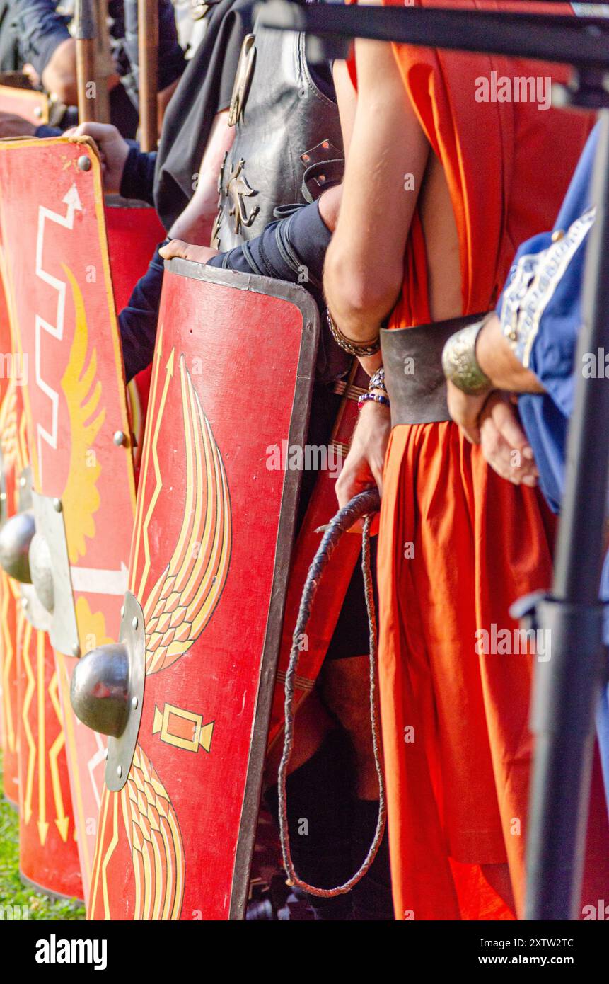 Roman legionaries with metal armor and shield at a historical ...