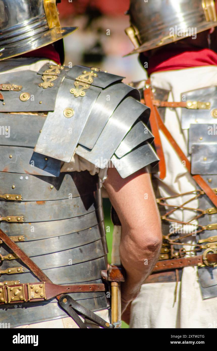 Roman legionaries in metal armor at a historical reenactment event seen ...