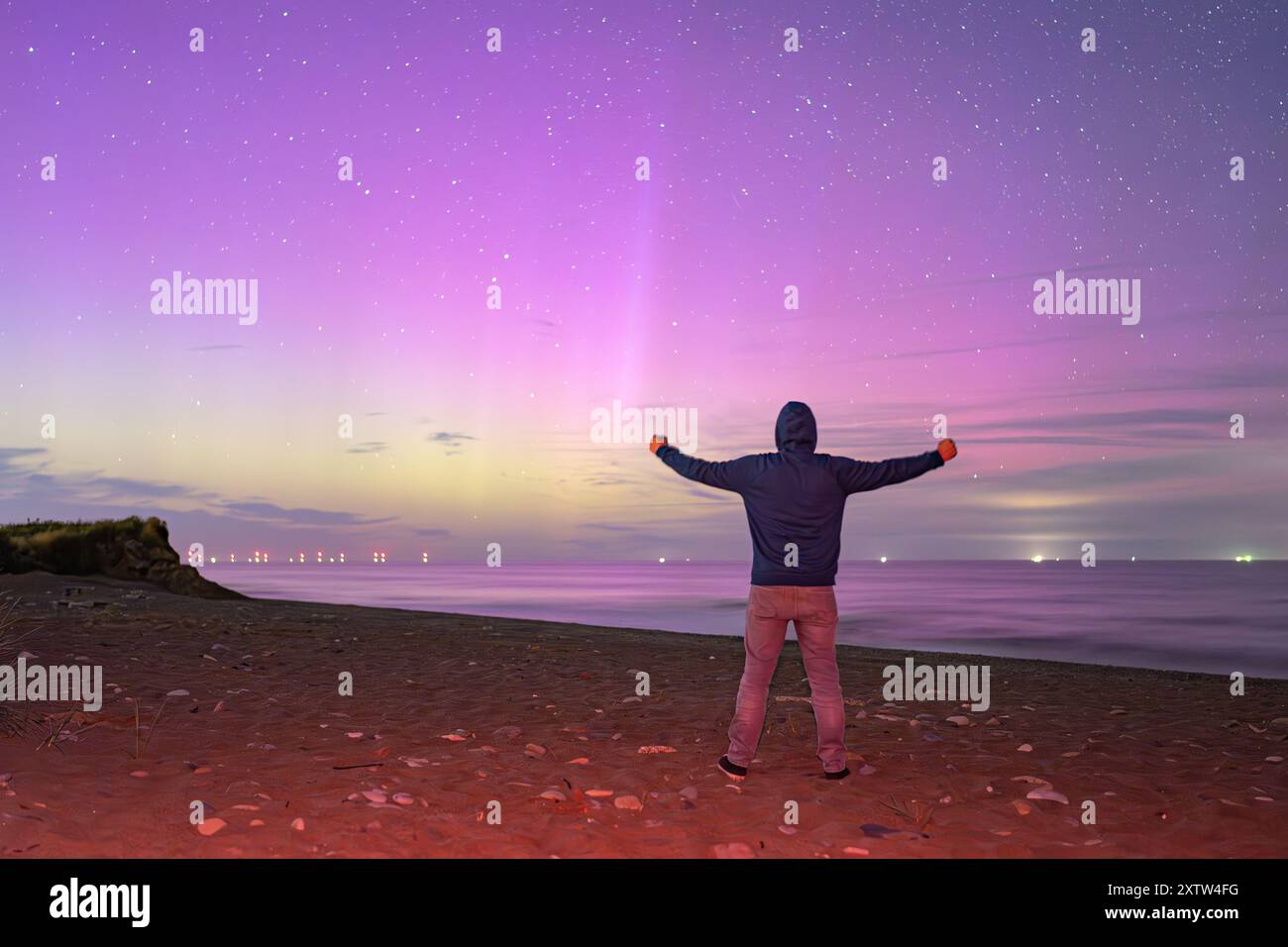 A man looking at the northern lights Stock Photo - Alamy