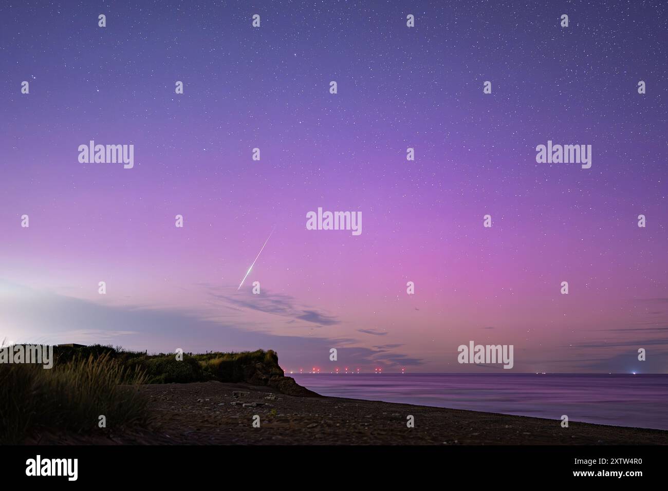 A meteor streaks across sky Northern Lights / Aurora during the ...