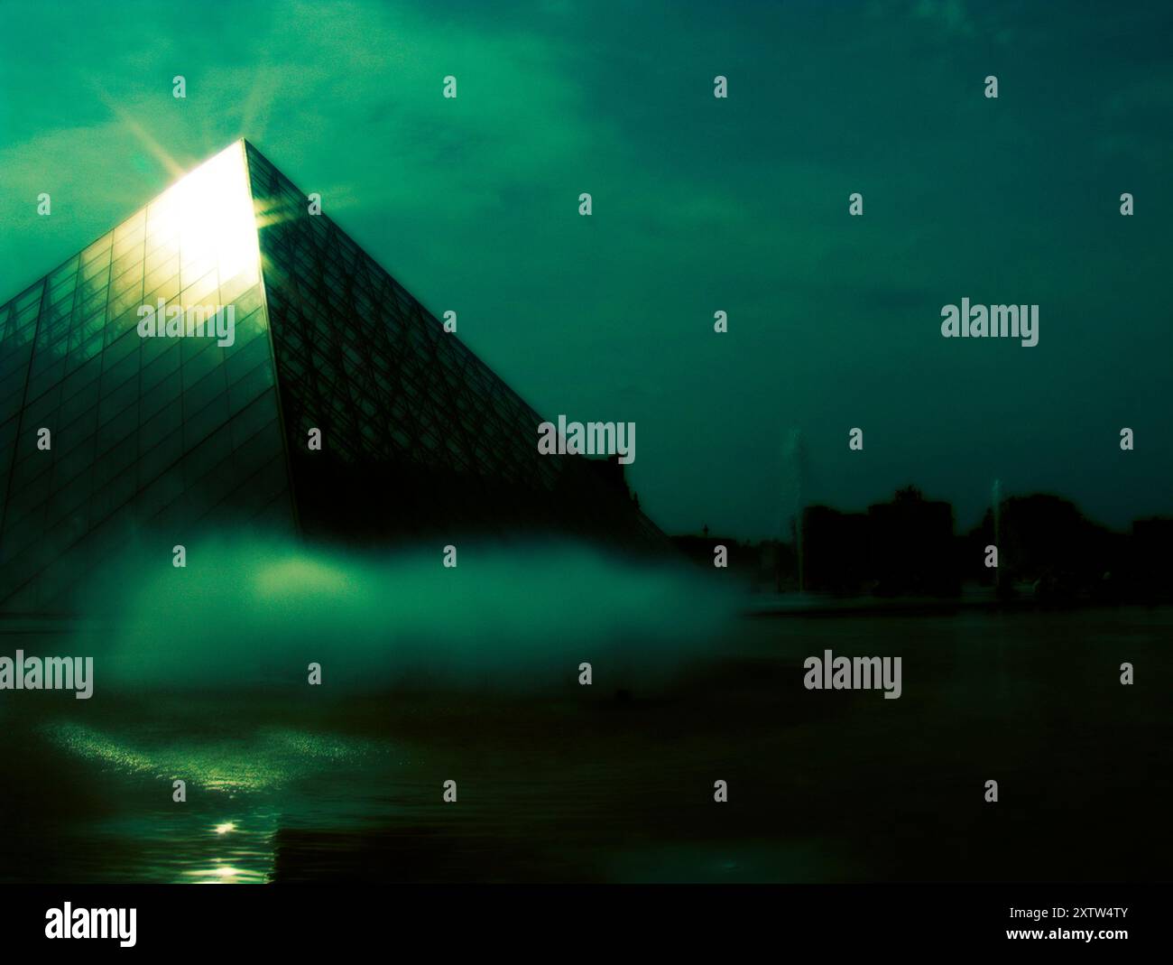 Louvre Pyramide at Louvre Museum - Palais Royal. On the background ...