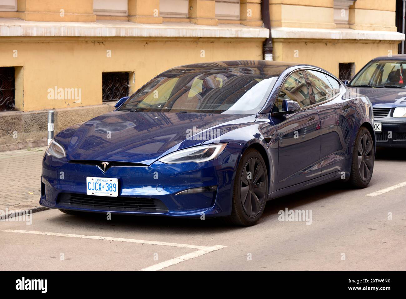 Blue electric Tesla Plaid car with Ontario Canada registration vehicle ...