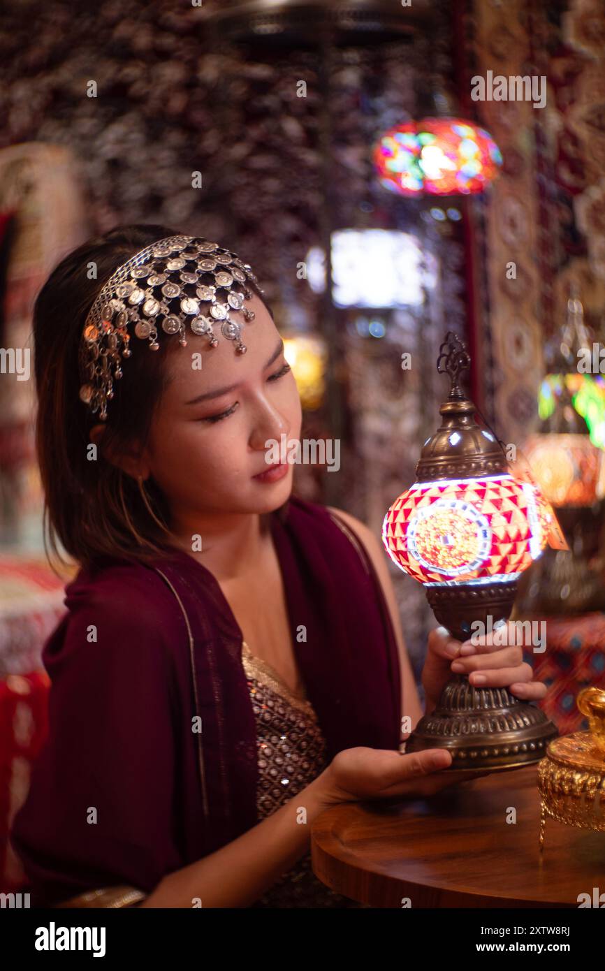 Beautiful Asian women in traditional Turkish fashion evening dress ...
