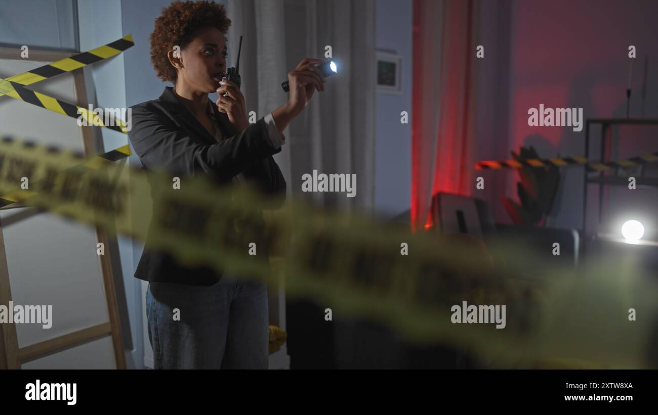 African american woman detective with flashlight and radio in dark ...