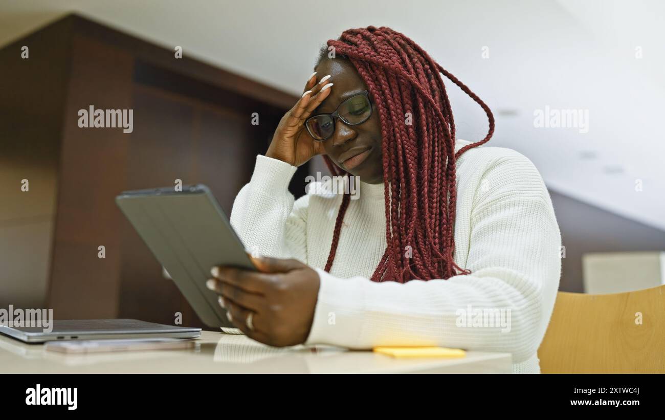 African american woman with braids feeling stressed at office while ...