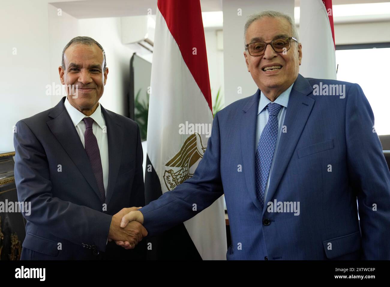 Lebanese Foreign Minister Abdallah Bouhabib, right, shakes hands with ...