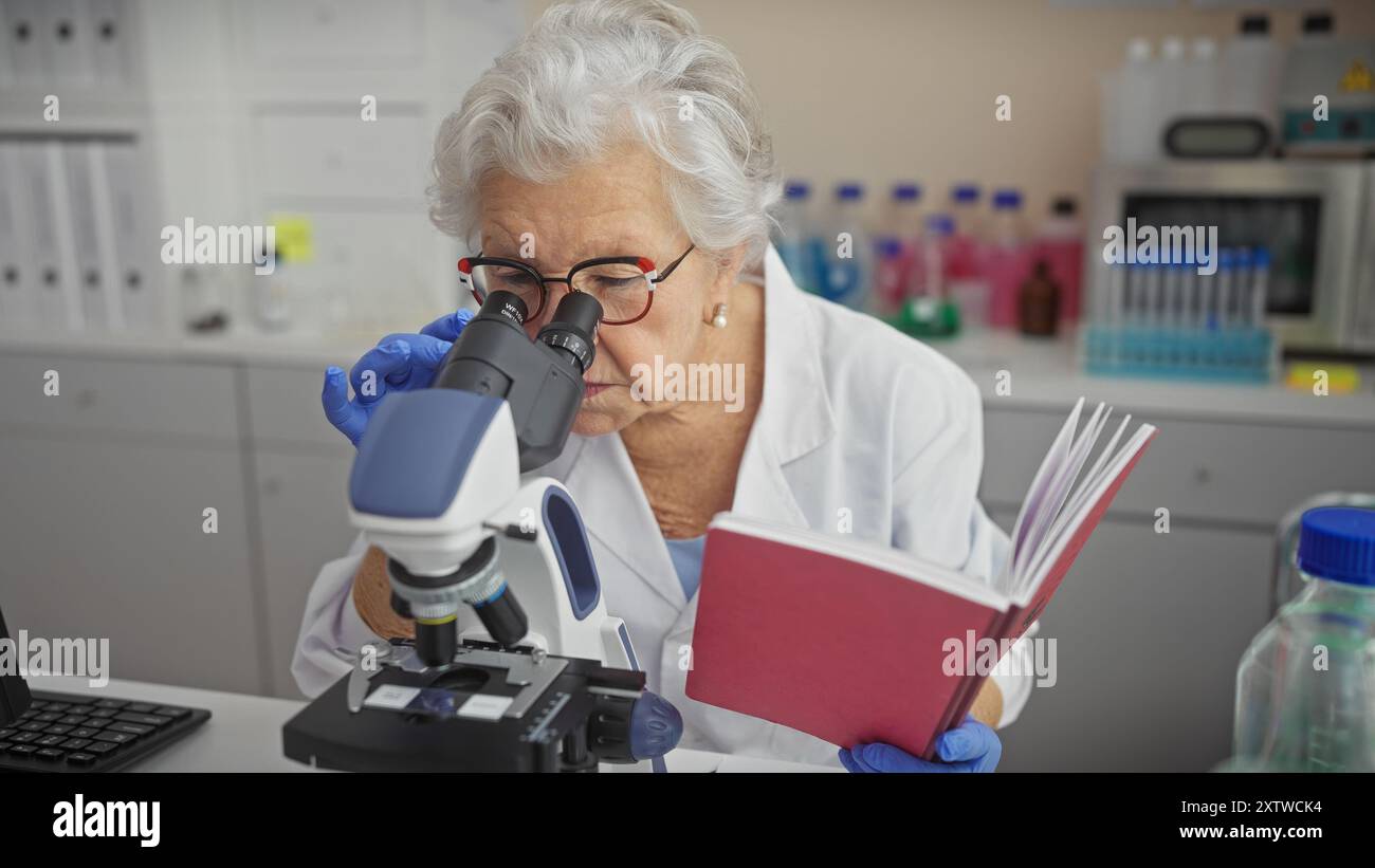 Senior woman scientist with grey hair analyzes samples using a ...