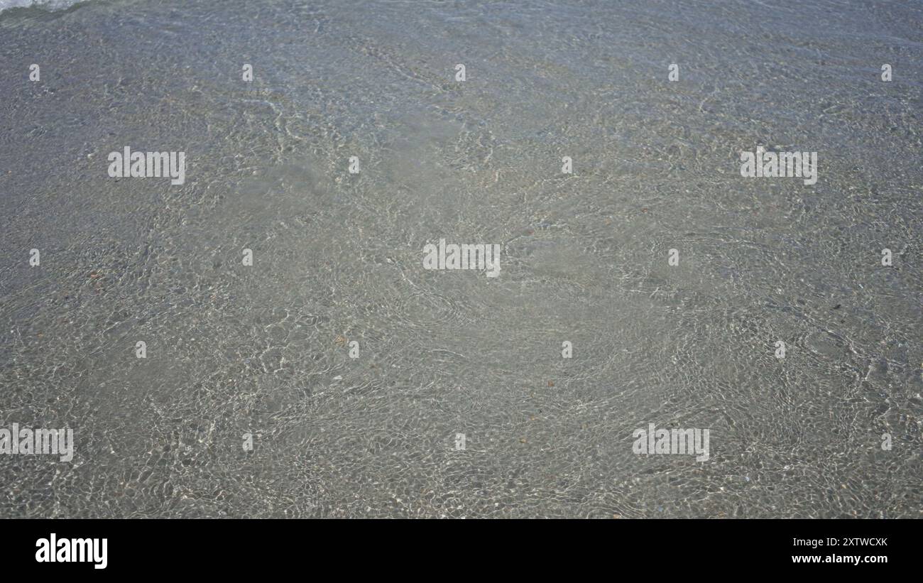 Transparent clear rippling seawater hi-res stock photography and images ...