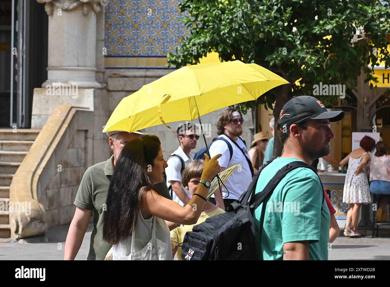 Valencia - Spain, 14-August-2024. Female tourist guide holds yellow ...