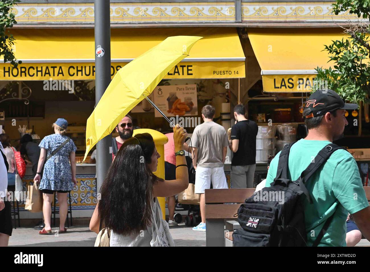 Valencia - Spain, 14-August-2024. Female tourist guide holds yellow ...