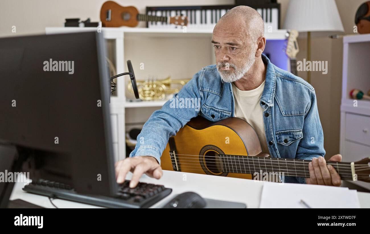 A middle-aged man with a guitar multitasks in an office setting ...