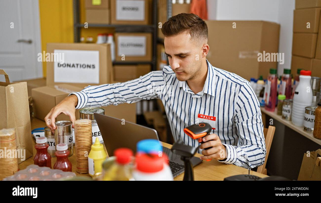 A young man scans items at a donation center, depicting volunteer ...