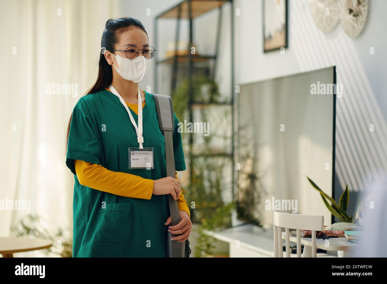 Caring Healthcare Worker Wearing Protective Mask Stock Photo - Alamy