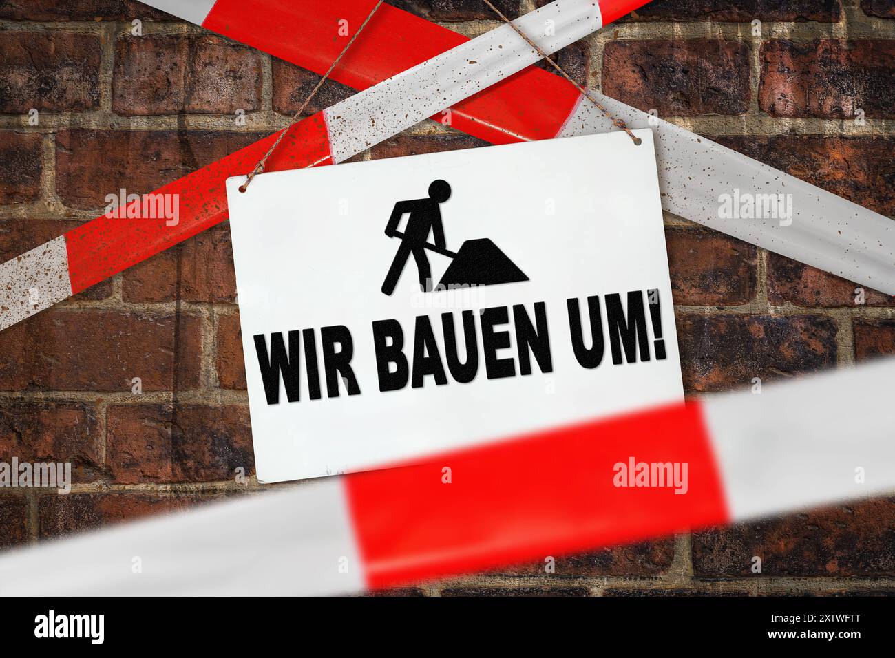 16 August 2024: We are rebuilding Sign in front of a wall with barrier ...