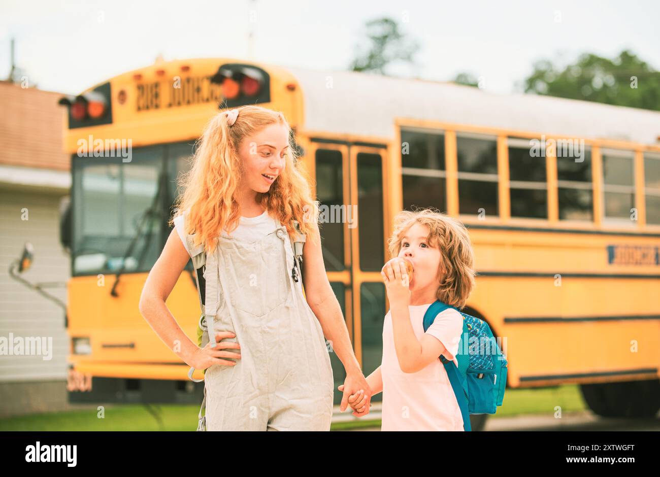 Elementary school students on school bus. Boy and teenager girl from ...