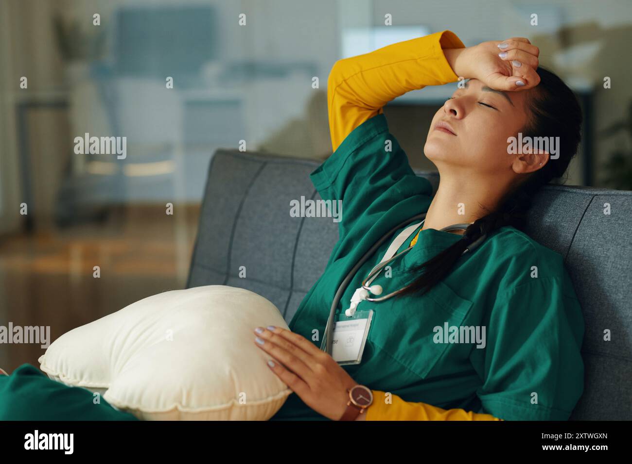 Tired Nurse Resting on Break in a Hospital Room Stock Photo - Alamy