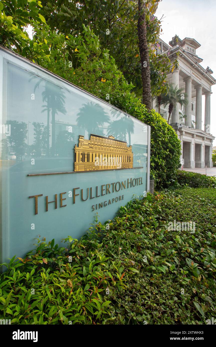 Vertical side view glass sign of The Fullerton Hotel in a green ...