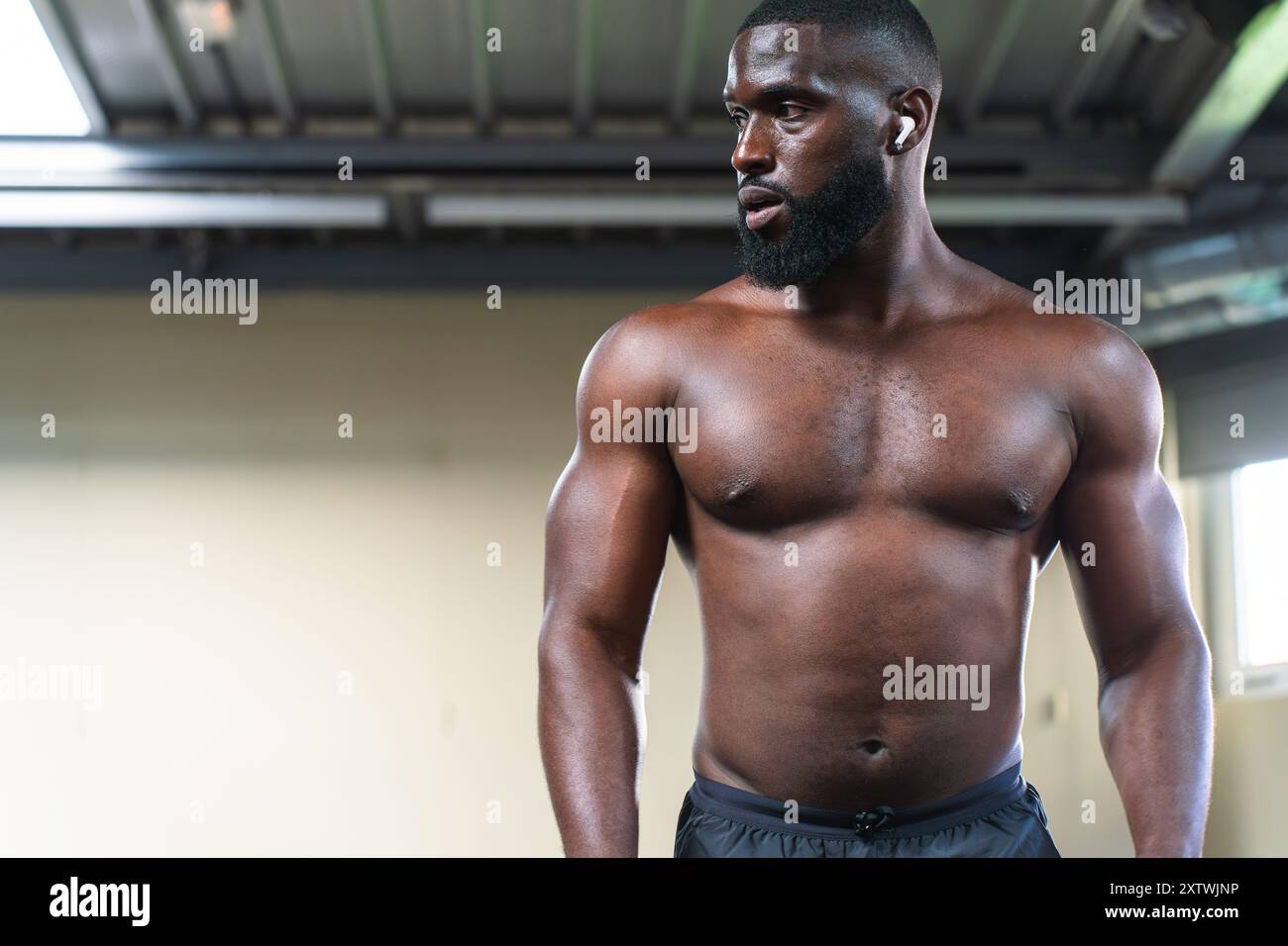 Black male bodybuilder in volume stage at the gym Stock Photo - Alamy