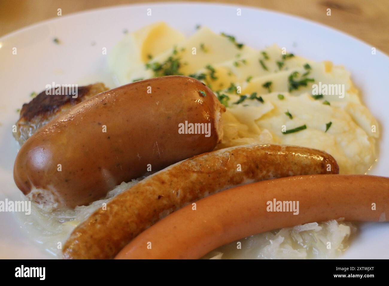 German cuisine: bratwurst (grilled pork sausages), mashed potatoes and ...