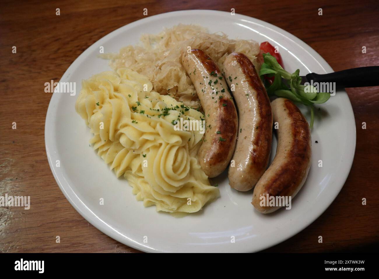 German cuisine: bratwurst (grilled pork sausages), mashed potatoes and ...