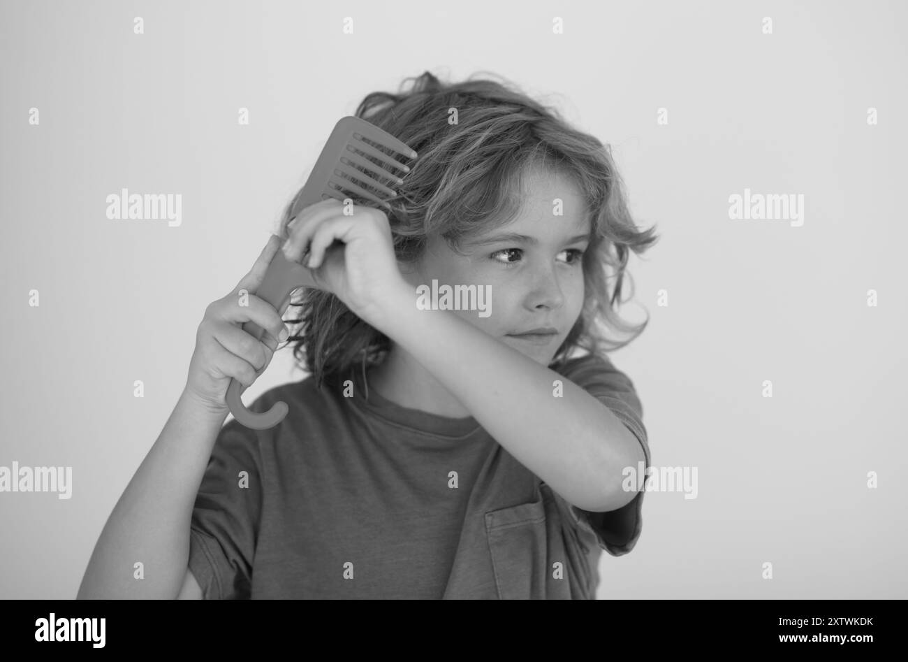 Comb and hair brush concept. Funny child hairstyle. Cute child with ...