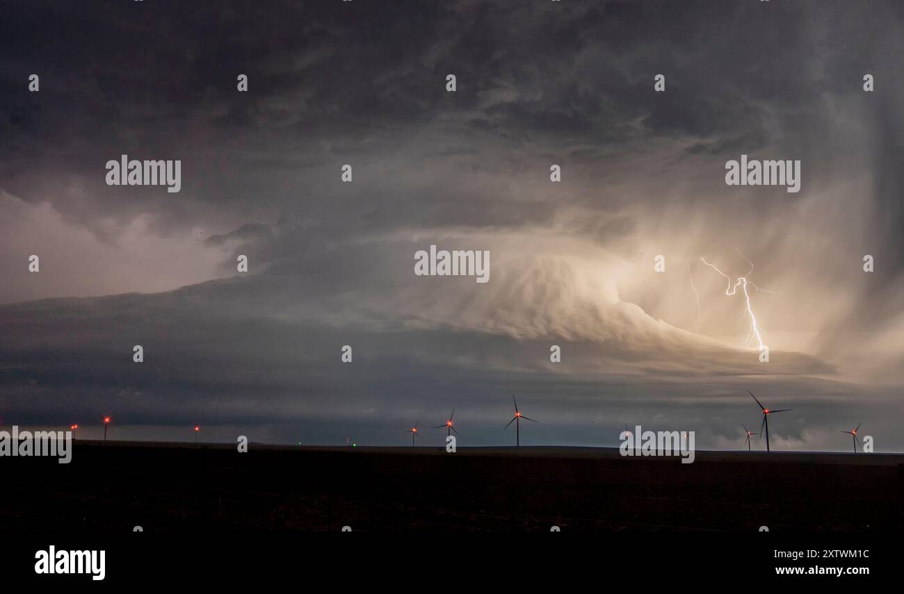 A dramatic nighttime scene of a lightning bolt striking amidst wind ...