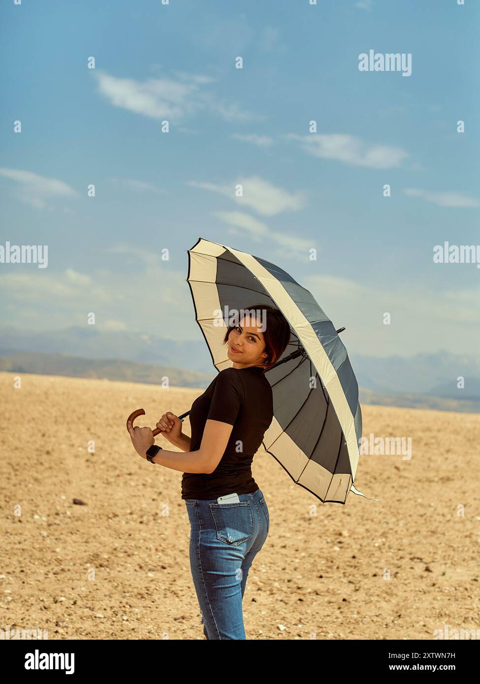 Woman gazing over shoulder in hi-res stock photography and images - Alamy