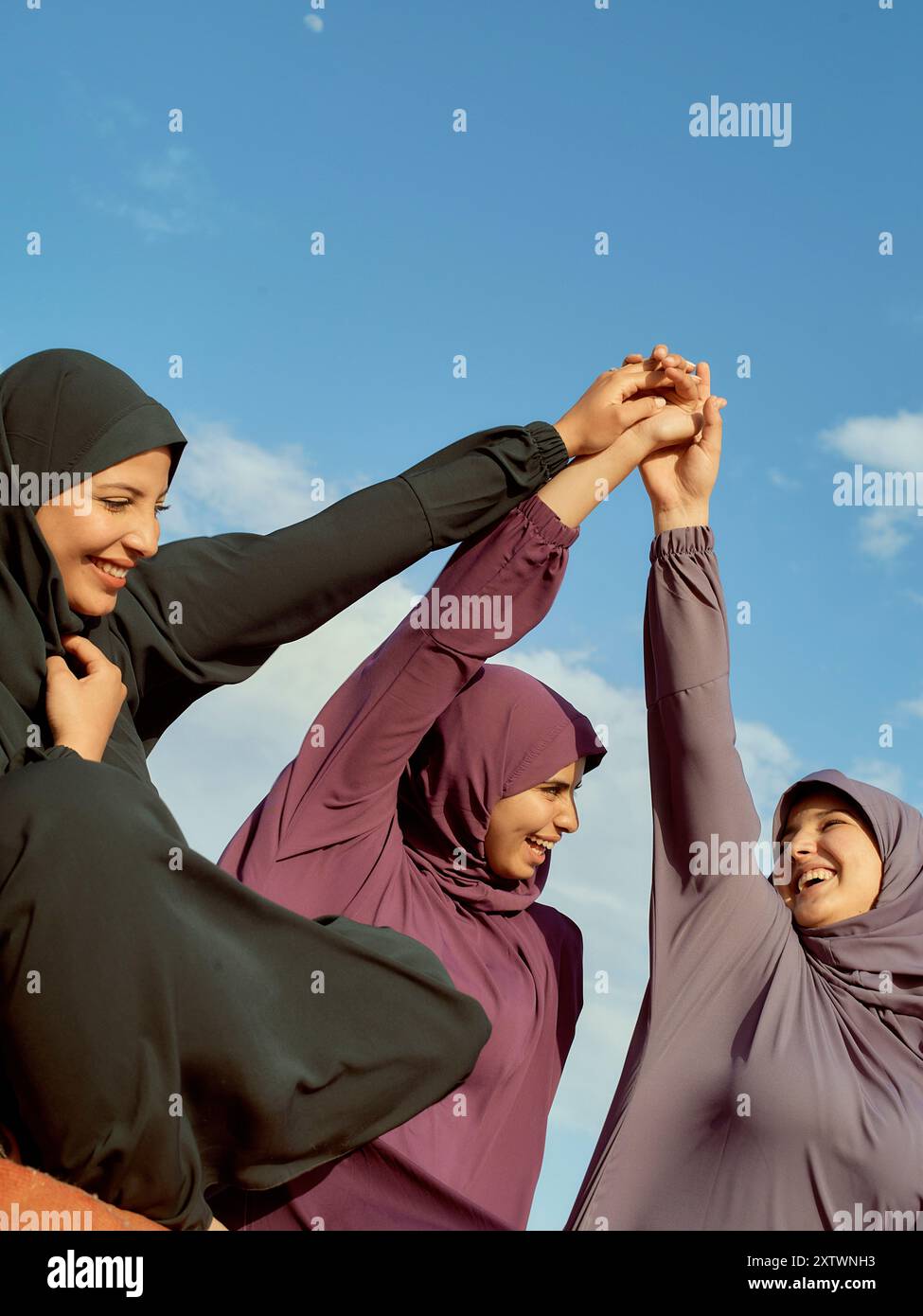 Blue hands up together hi-res stock photography and images - Alamy