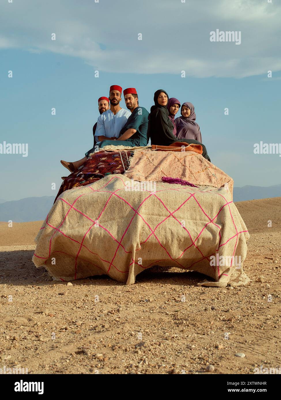 In traditional attire sits atop hi-res stock photography and images - Alamy