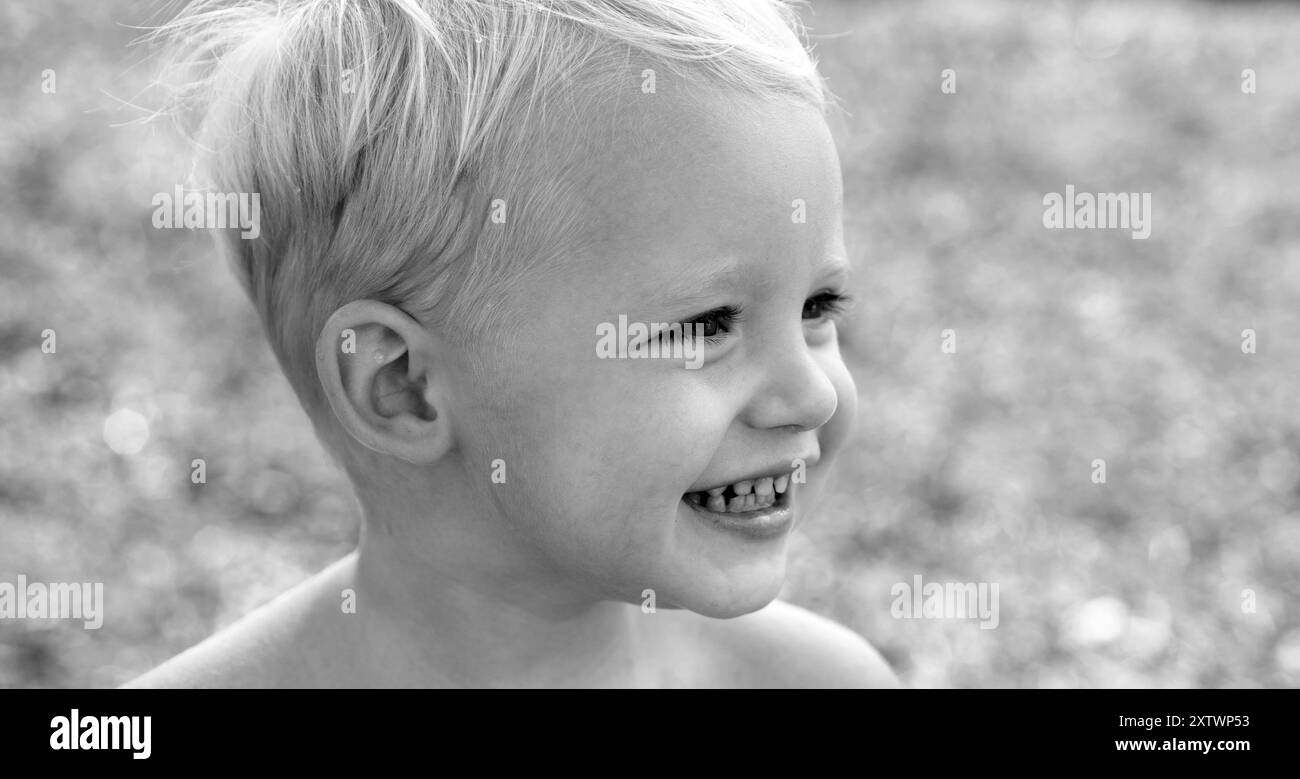 Cute kids face. Closeup portrait of smiling child boy on green ...