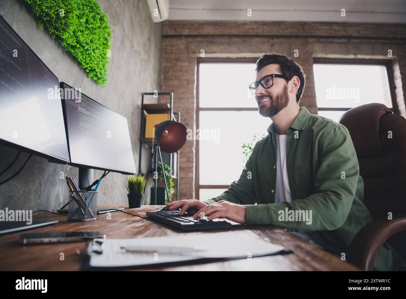 Portrait of professional hacker young man write keyboard computer desk ...