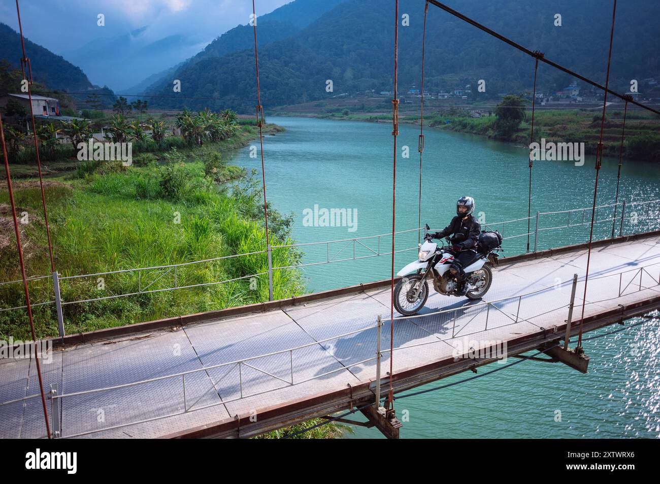 Motorcycle rides across bridge over hi-res stock photography and images ...